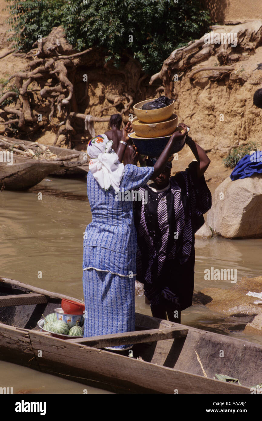 Ayorou, Niger River, Niger, Africa. Adjusting Load on Head prior to ...