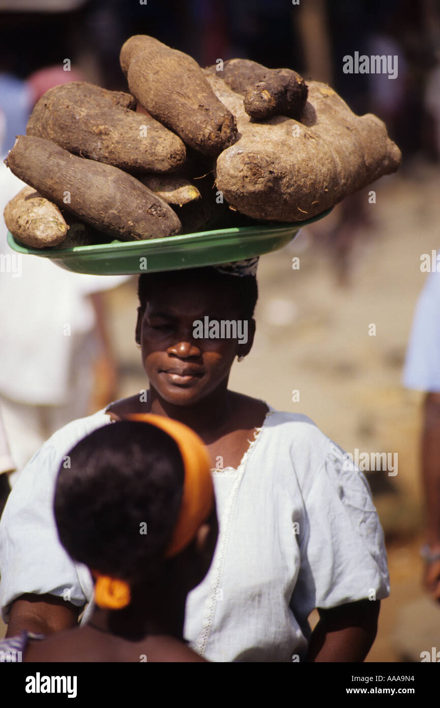 Abidjan, Ivory Coast, Cote d'Ivoire, West Africa. Woman Carrying Yams ...