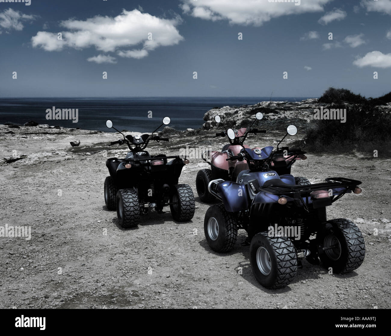 Three PGO X Rider ATV all terrain vehicles on a rocky seashore Stock ...