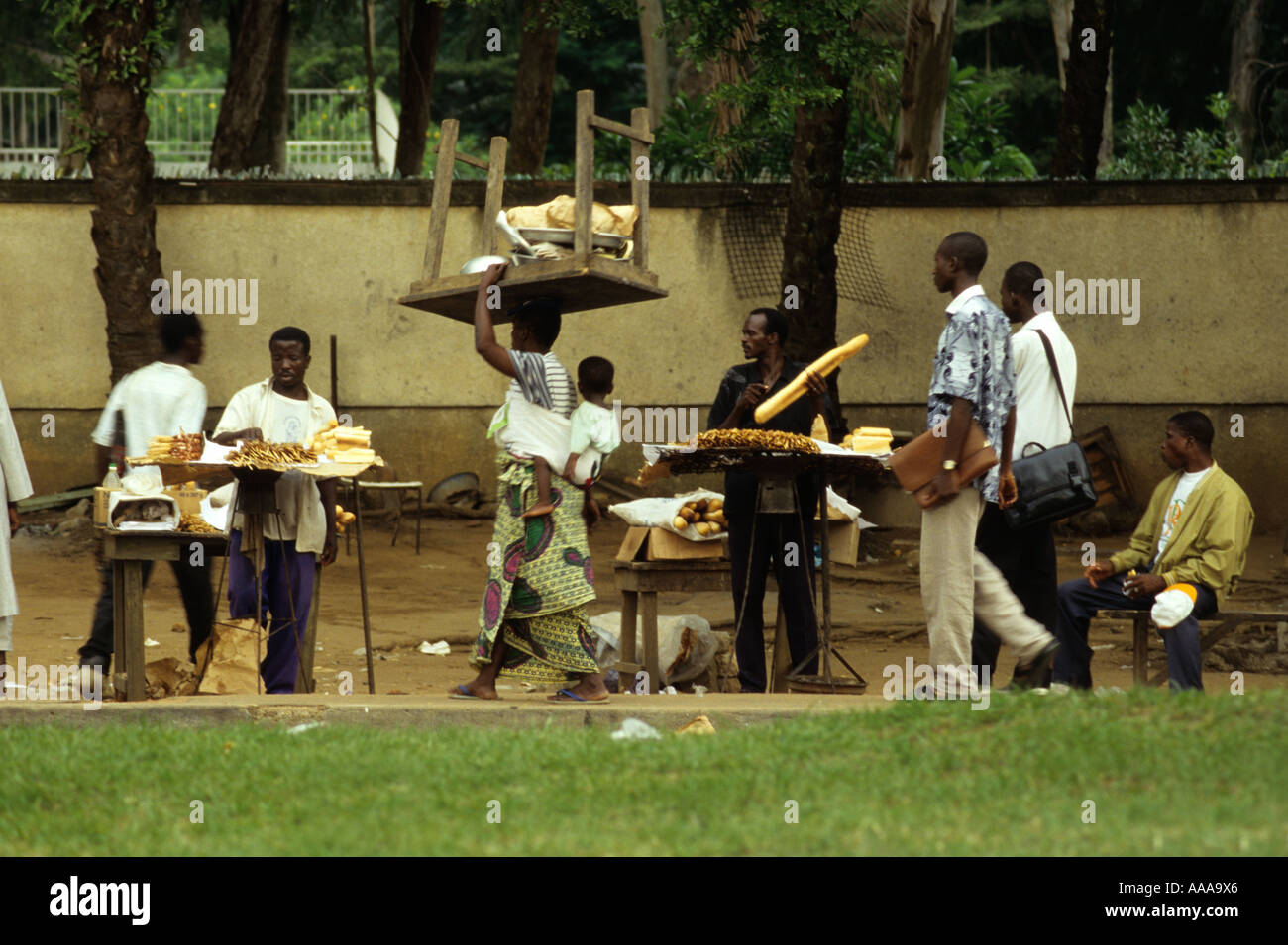 Abidjan, Ivory Coast, Africa. Ivorian Woman Carrying Table on Head ...