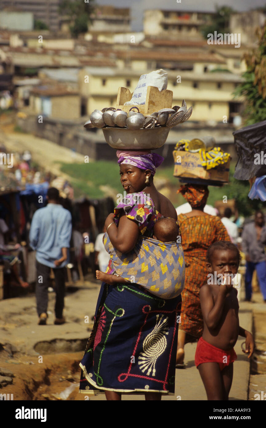 Abidjan ivory coast woman carrying baby back hi-res stock photography ...