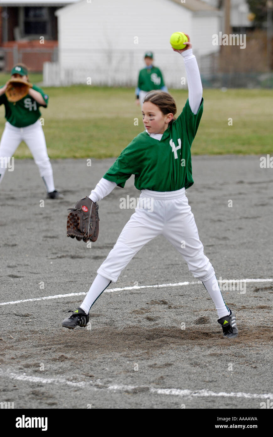 Baseball action girls playing softball hi-res stock photography and ...