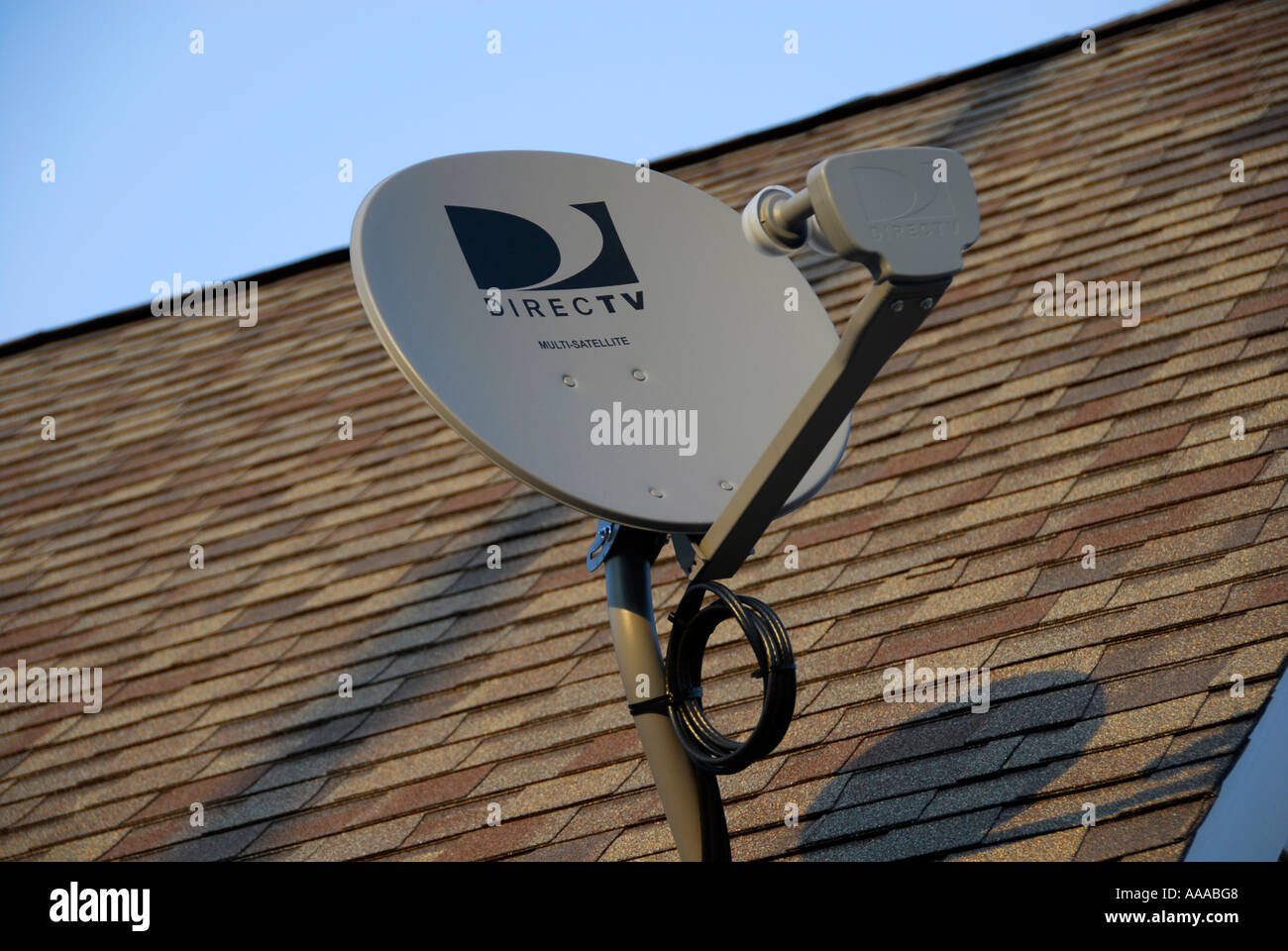 Satellite dish on the roof of a home provides home owner with choices ...