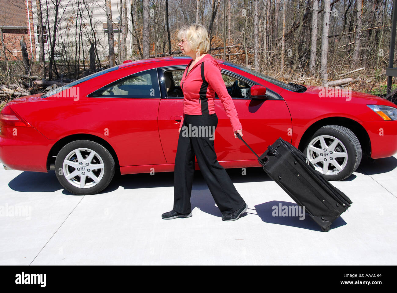 Female with suitcase Showing the concept of pulling and pushing pull ...