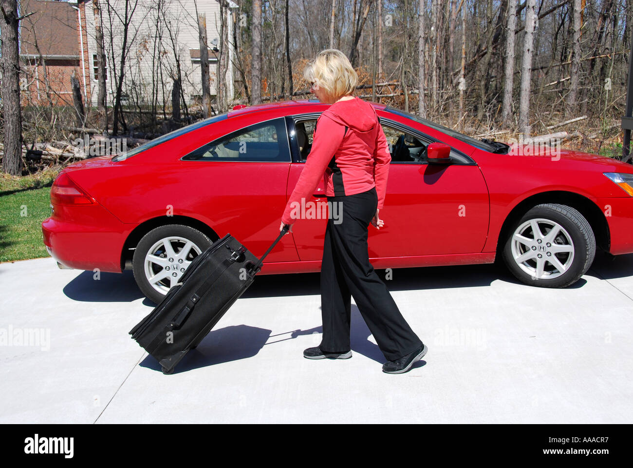 Female with suitcase Showing the concept of pulling and pushing pull ...