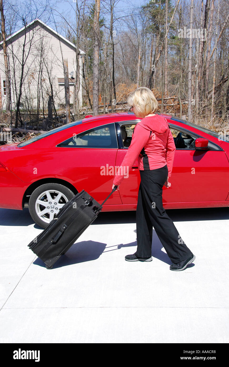 Female with suitcase Showing the concept of pulling and pushing pull ...