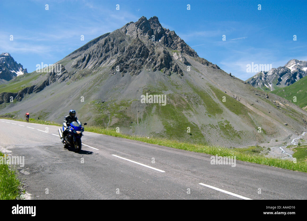 Motorcyclist on the road D902 between the Col du Telegraphe and the Col ...