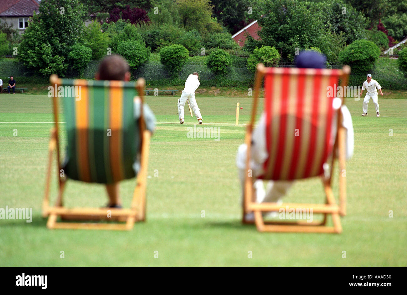Spectators watch a cricket match Stock Photo - Alamy