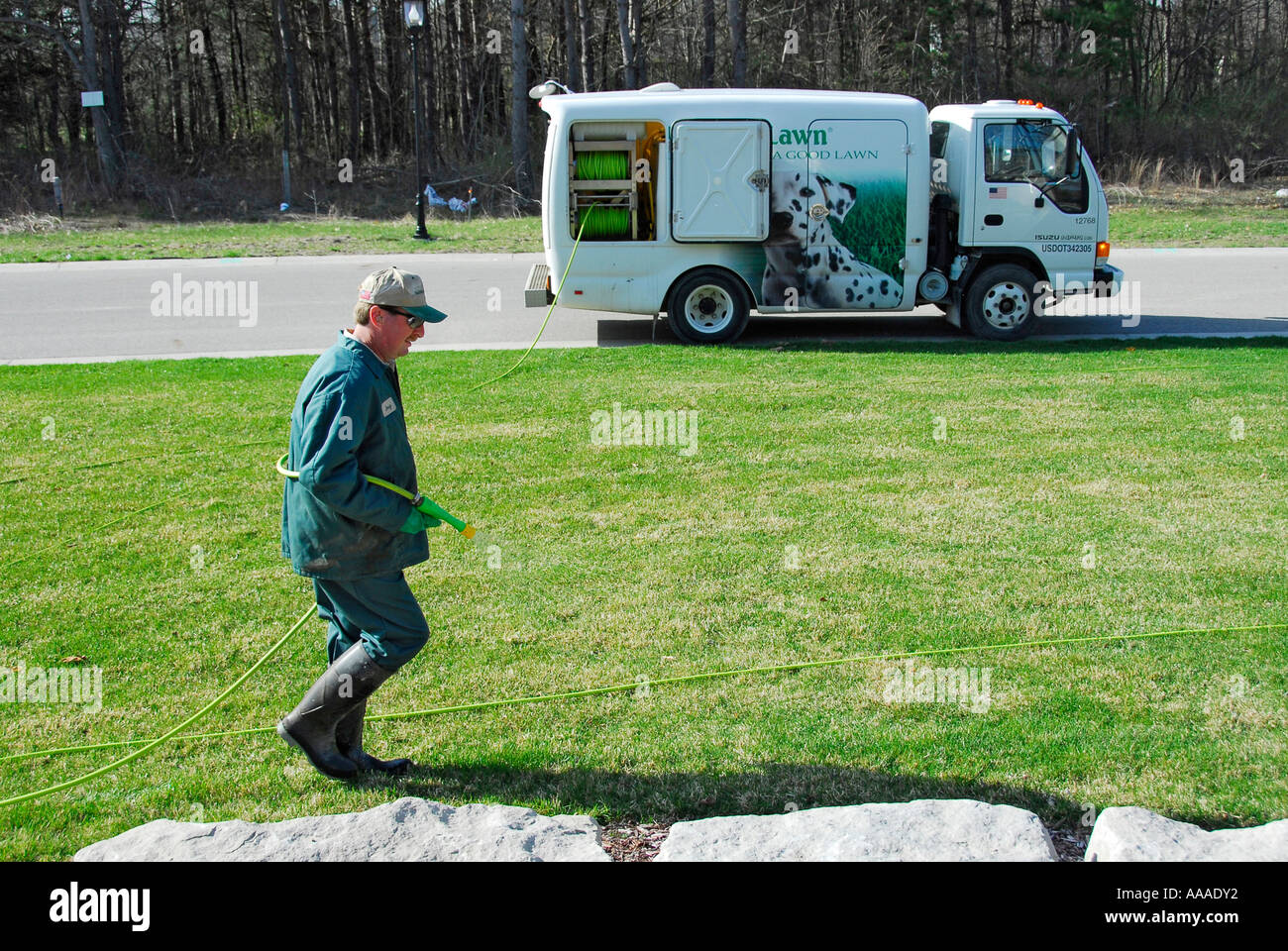 Professional lawn fertilizer and pesticide control applied to a ...