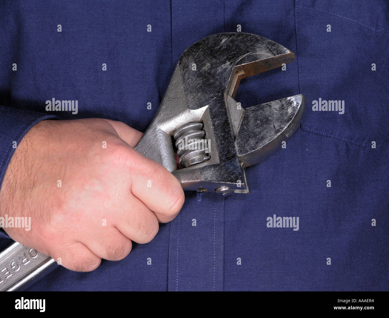 Workman holding tool - Adjustable Wrench (Spanner Stock Photo - Alamy
