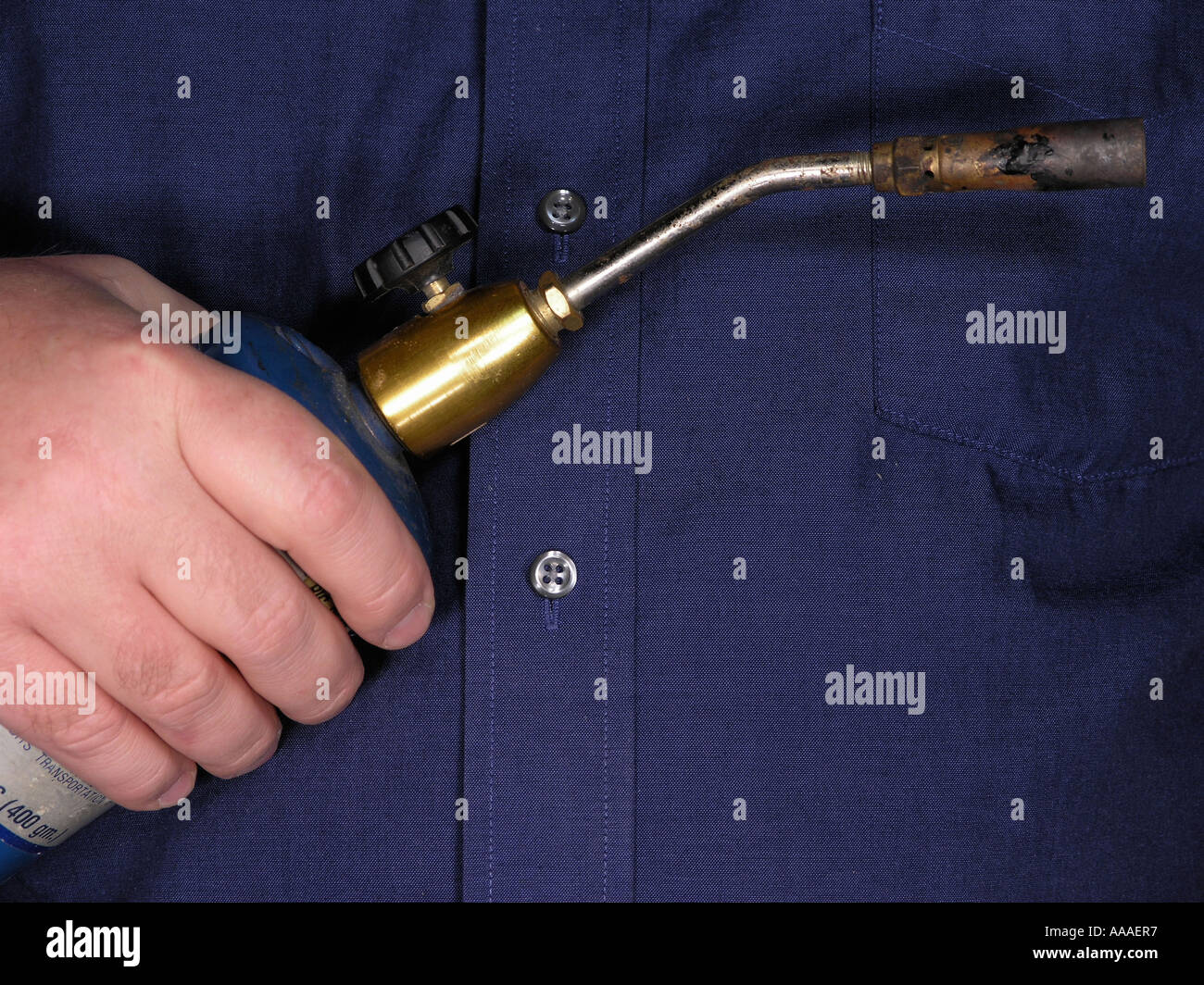 Workman holding tool - Propane Torch Stock Photo - Alamy