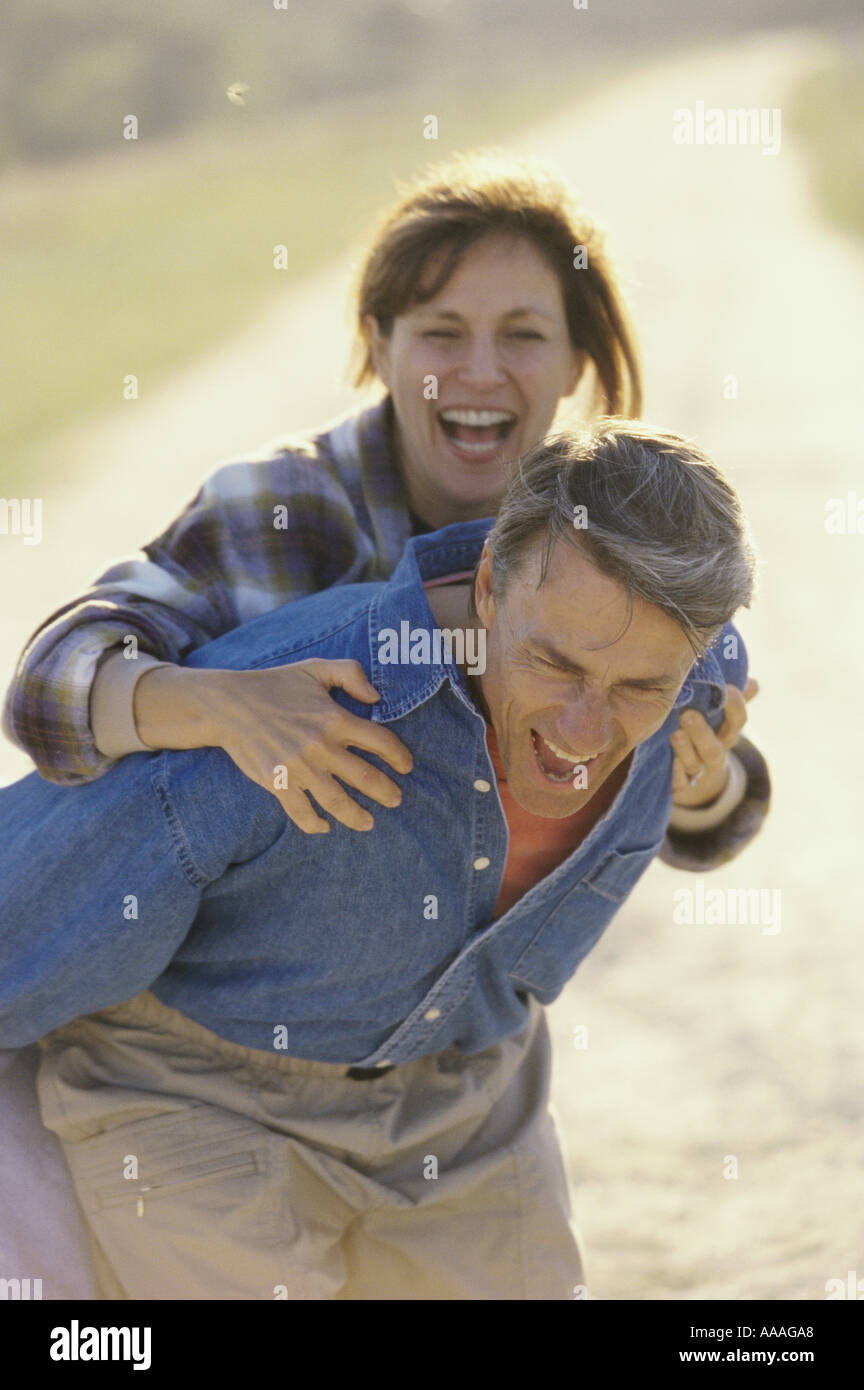 Woman riding piggyback on a man Stock Photo - Alamy Woman riding piggyback on a man Stock Photo - Alamy
