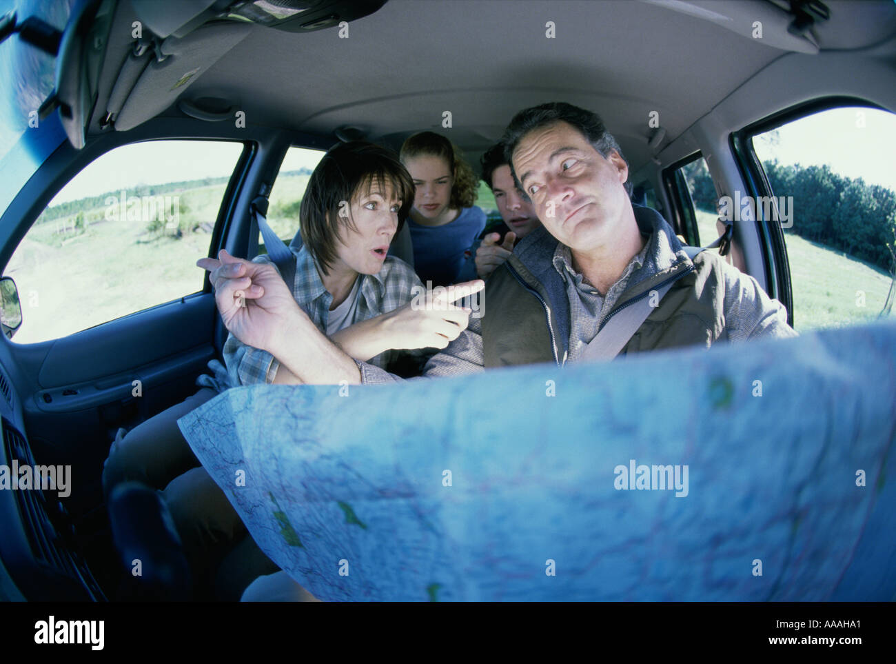 Couple arguing over a map Stock Photo - Alamy