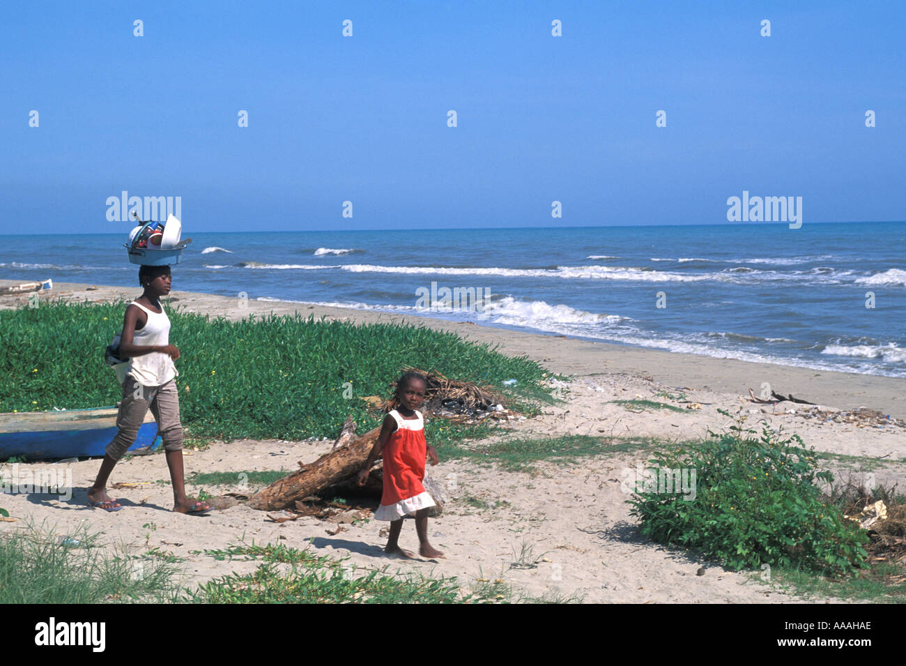 Honduras Garifuna mother and daughter walking on beach Sambo Creek ...