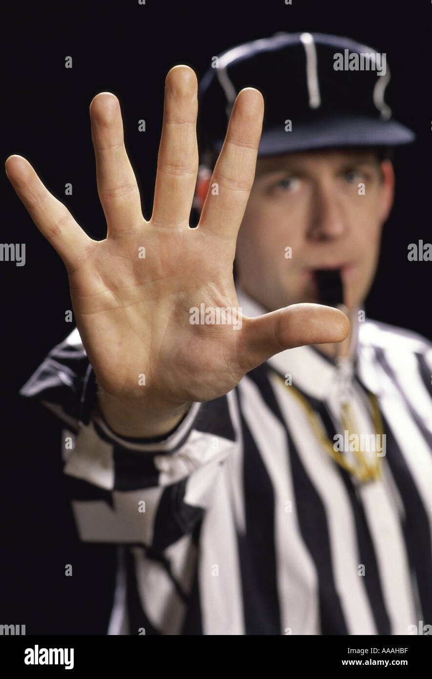 Portrait of a referee blowing a whistle Stock Photo - Alamy