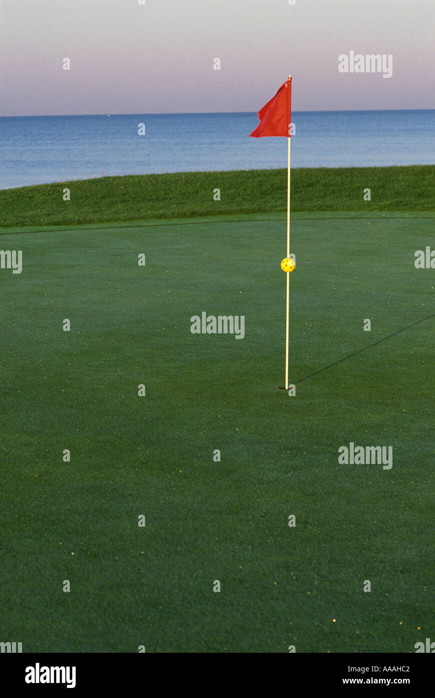 Flag on a golf course Stock Photo - Alamy