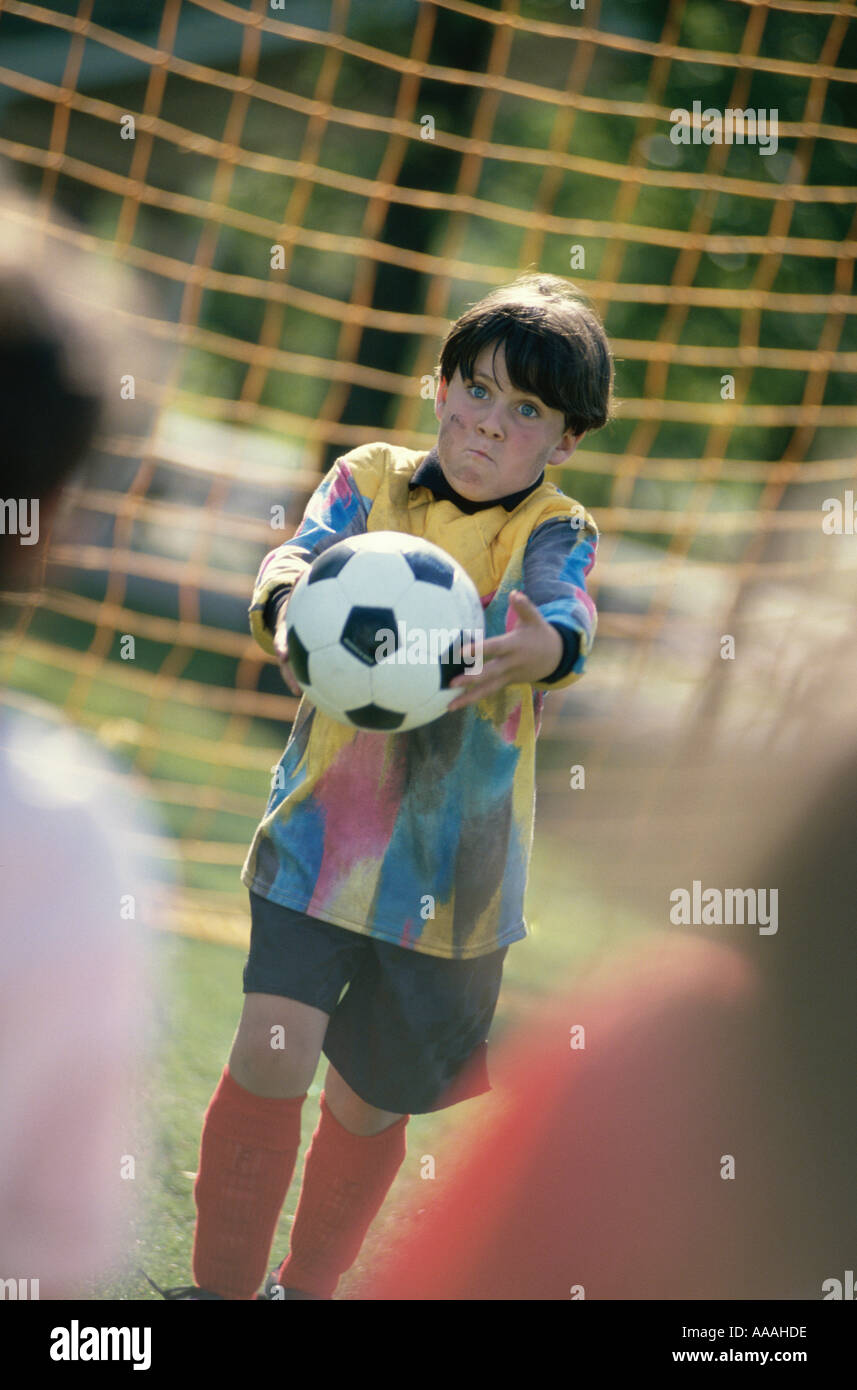 Goalie holding a soccer ball Stock Photo - Alamy