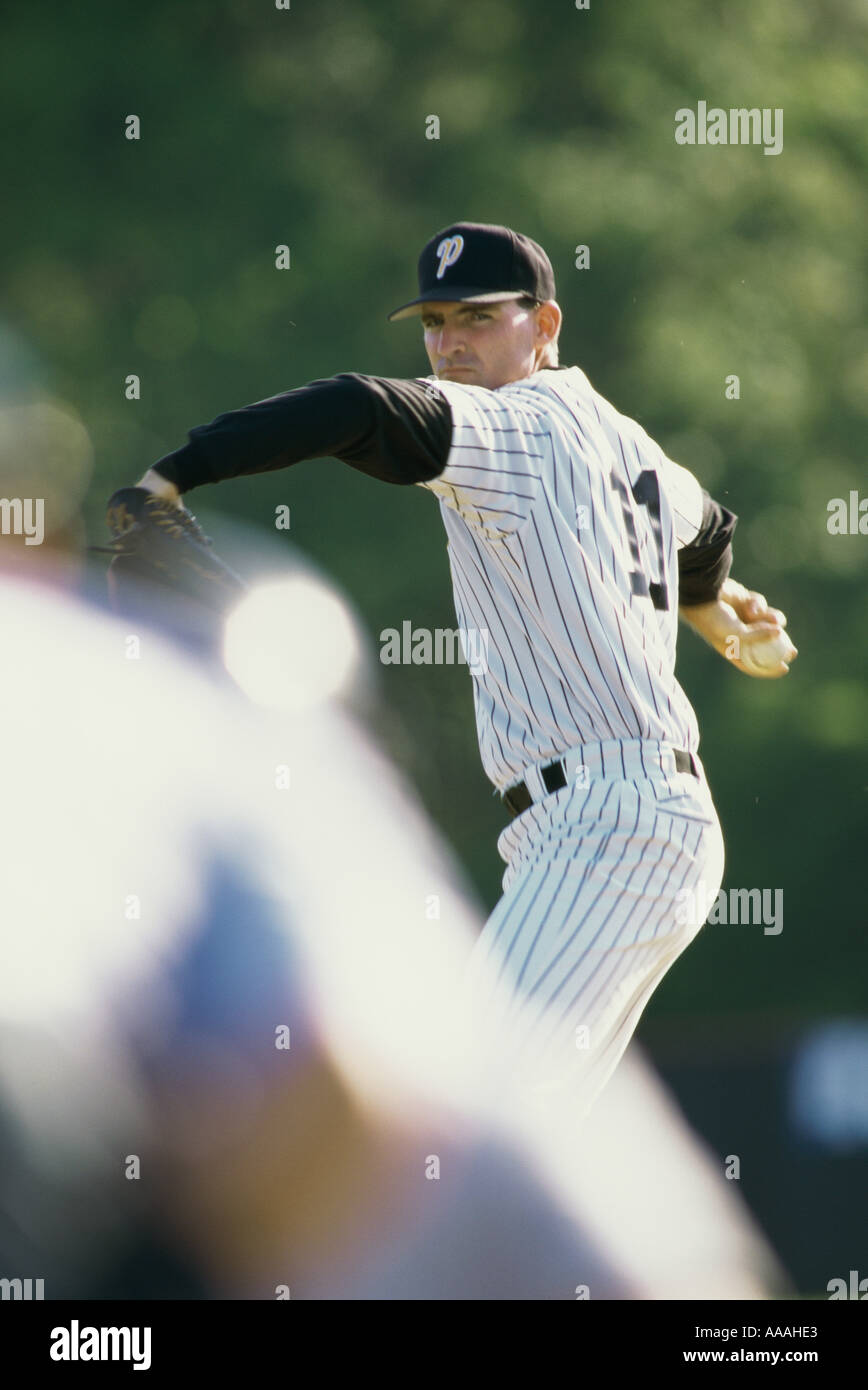 Baseball player throwing a pitch Stock Photo - Alamy
