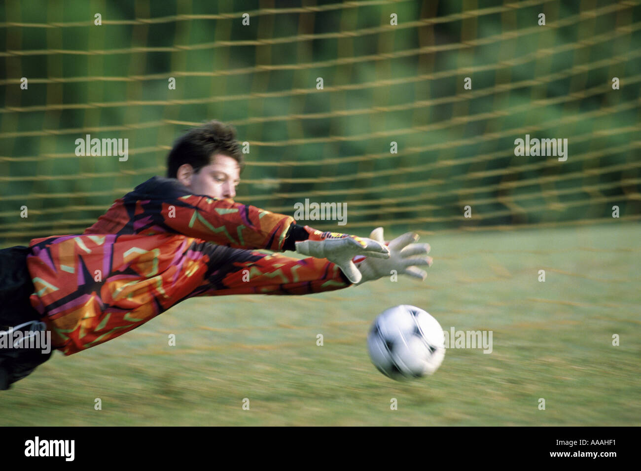 Diving on ball hi-res stock photography and images - Alamy