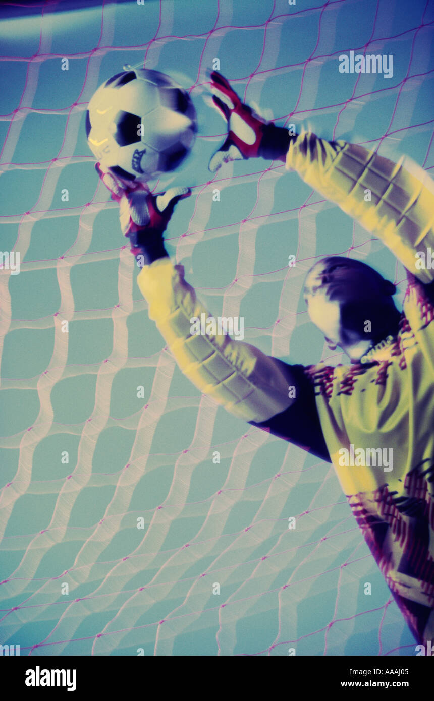 Low angle view of a goalie catching a ball Stock Photo - Alamy
