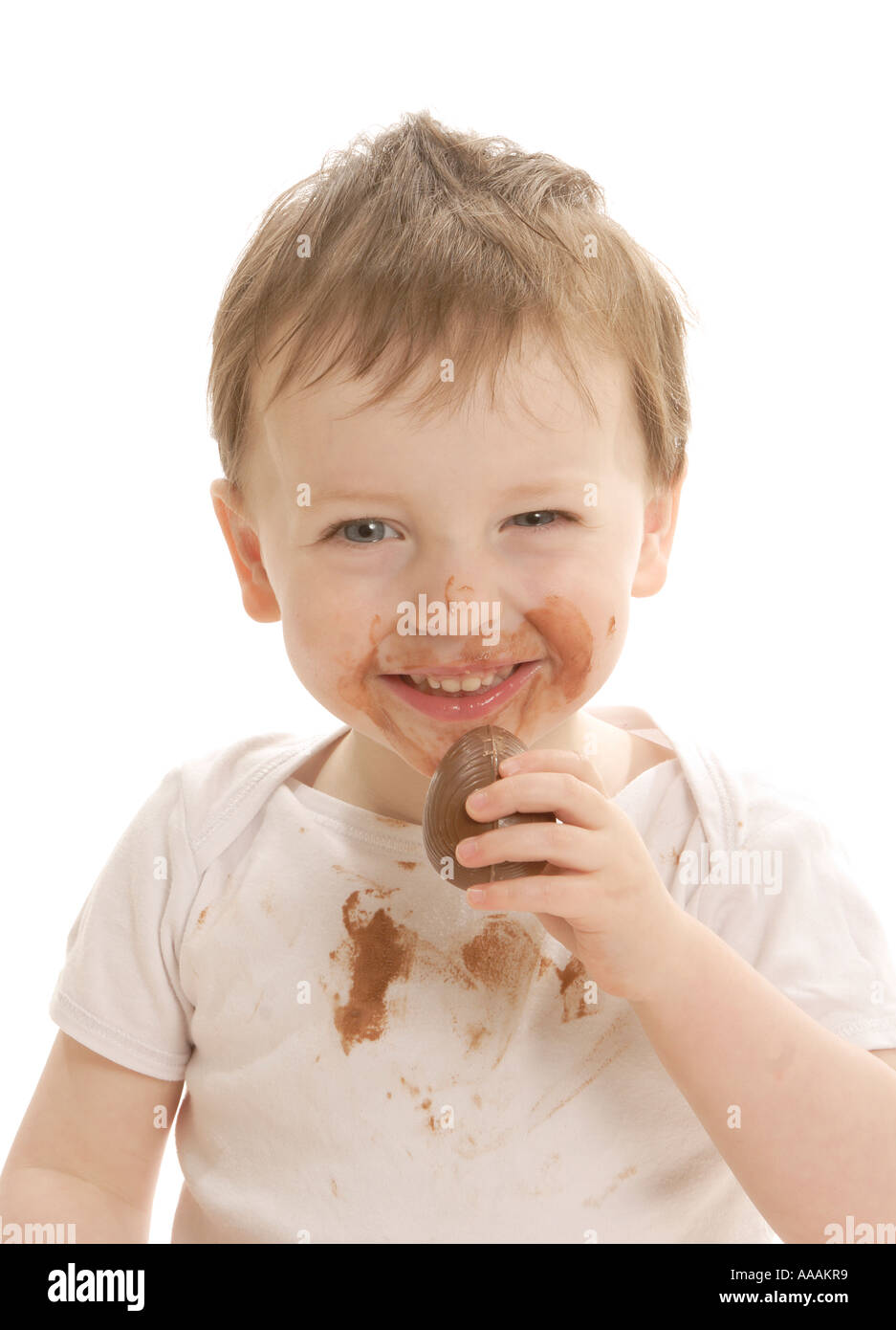 Toddler eating chocolate Easter Egg Stock Photo - Alamy