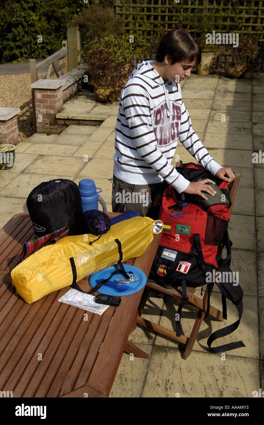 Boy packing rucksack for camping trip Stock Photo - Alamy