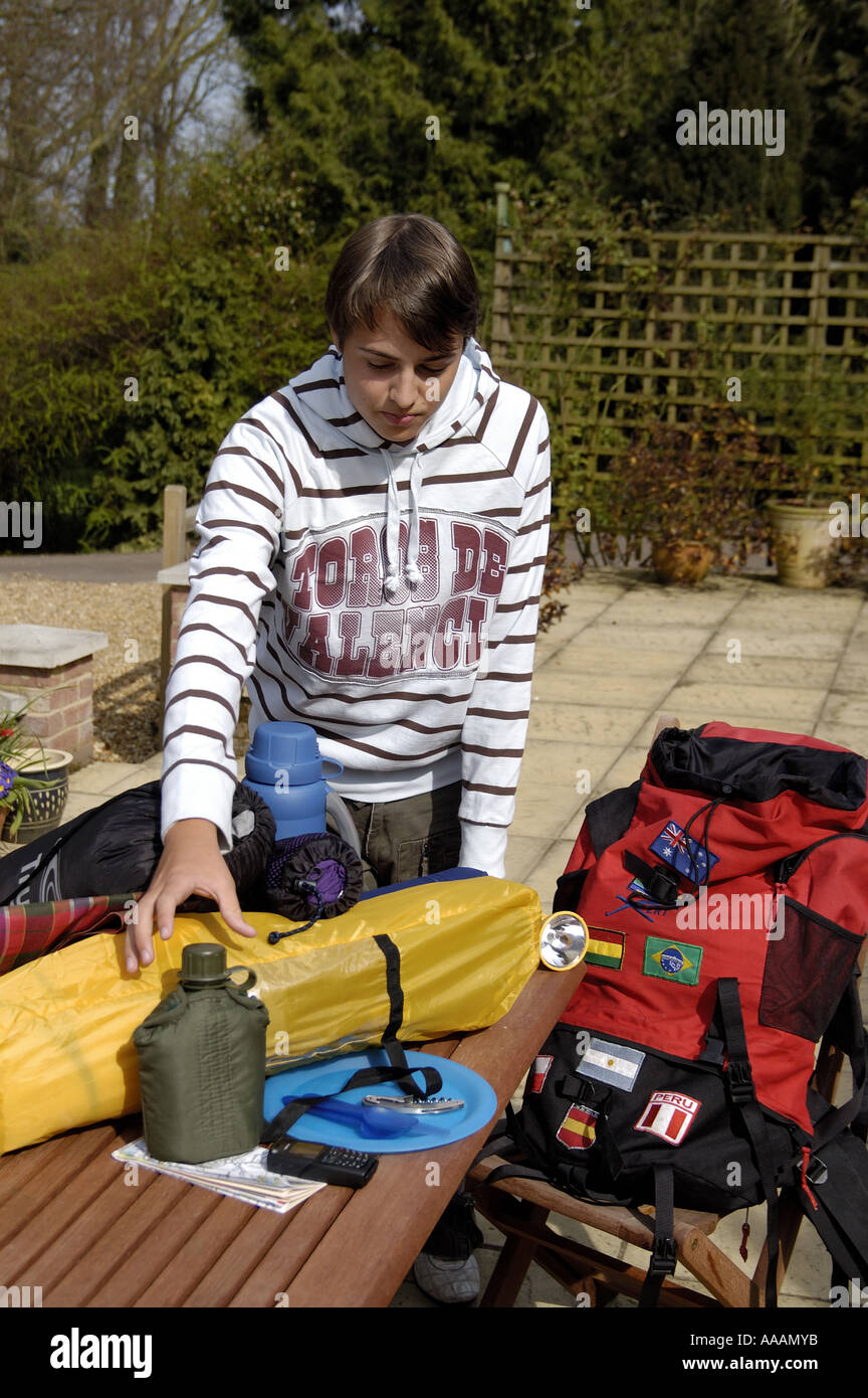 Boy packing rucksack for camping trip Stock Photo - Alamy