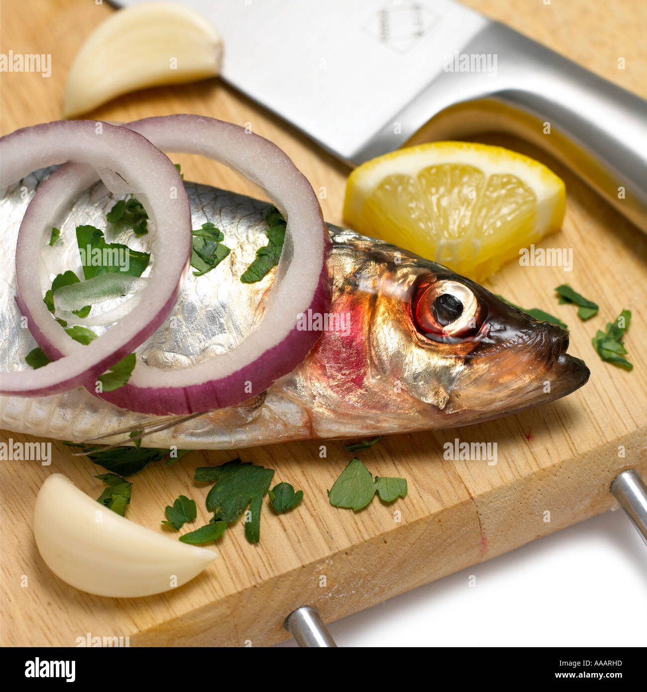 Fish on chopping board Stock Photo - Alamy