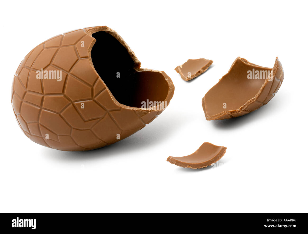 Cracked easter egg cut out onto a white background Stock Photo - Alamy
