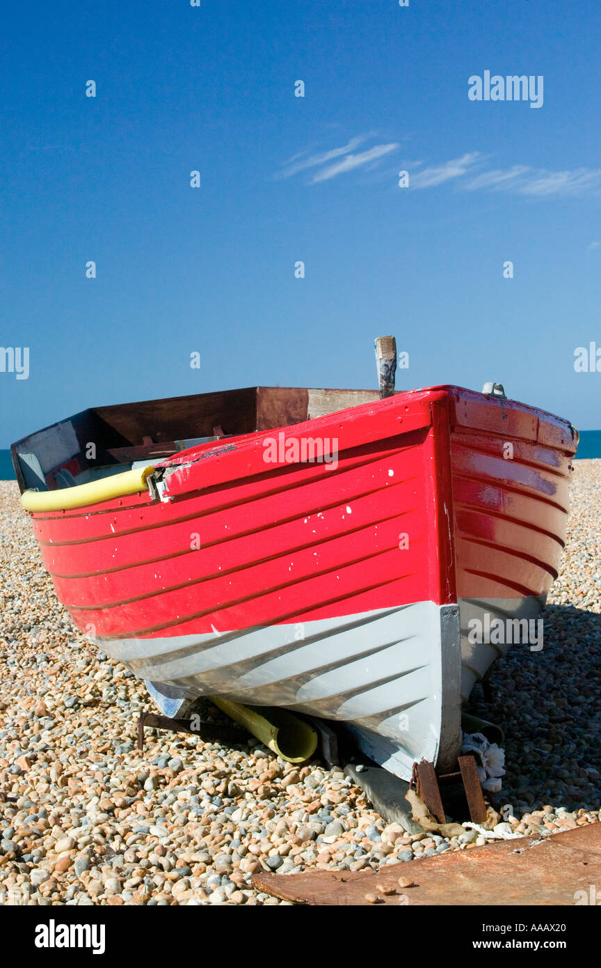 Red and white wooden rowing boat on Brighton beach, UK Stock Photo - Alamy