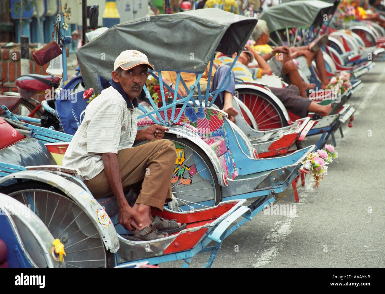 Trishaw Taxi Driver Sitting In Trishaw Stock Photo - Alamy