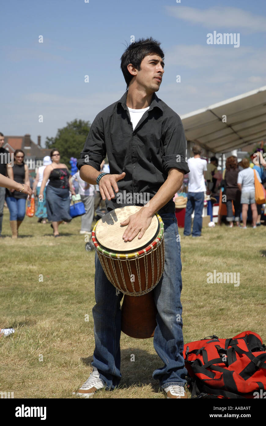Man Playing Bongo Drum at Wimbledon Village Fair Stock Photo - Alamy