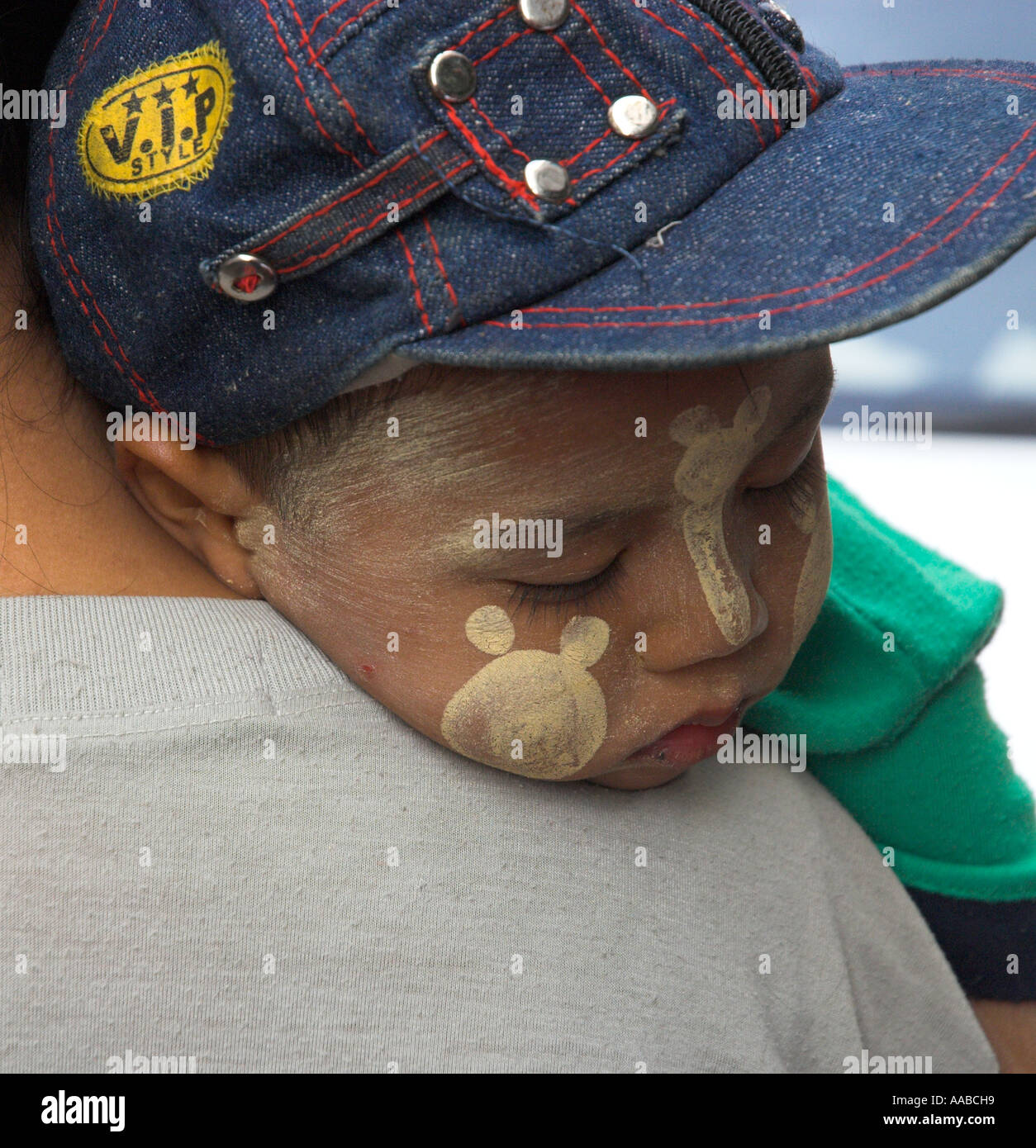 Myanmar Burma Rangon Yangon portrait of a young boy sleeping on his ...