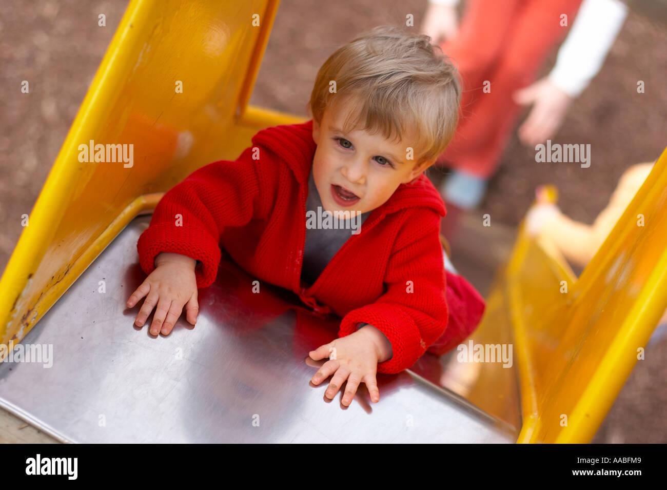 little boy on slide Stock Photo - Alamy