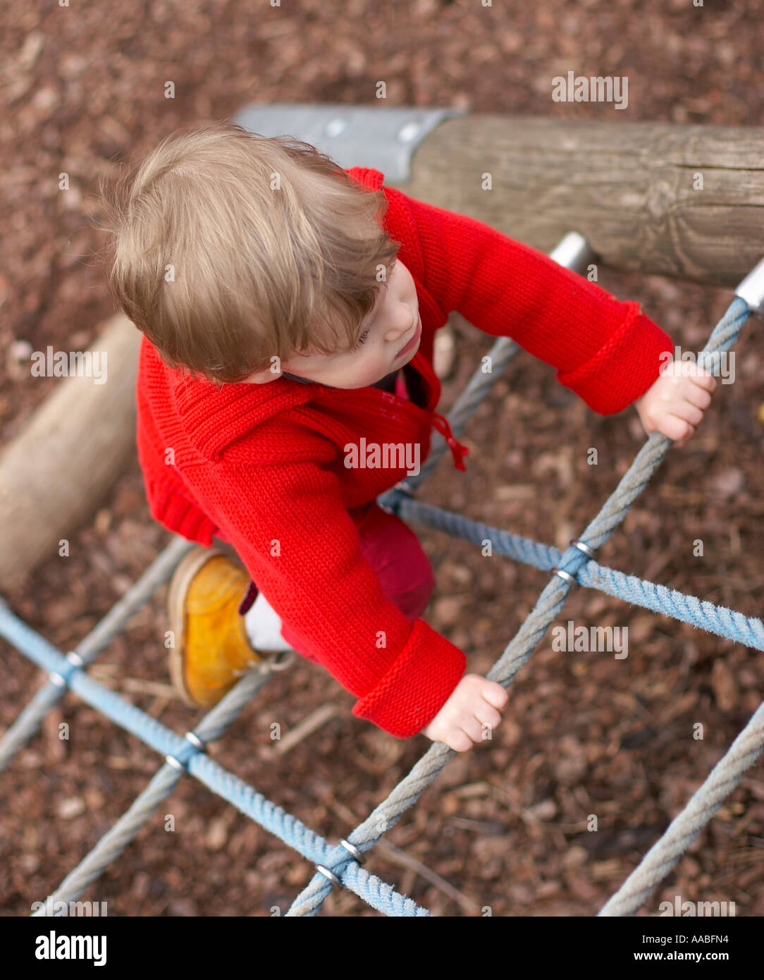 little boy climbing Stock Photo - Alamy