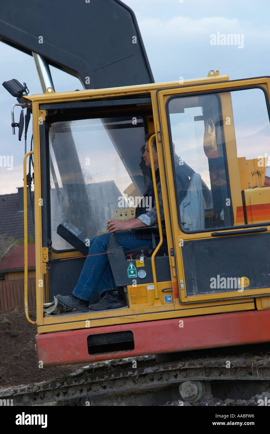 working with the excavator Stock Photo - Alamy