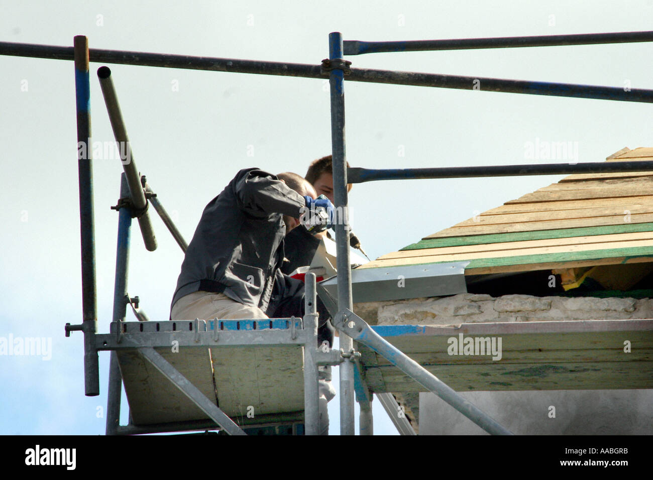 workman on a scaffolding Stock Photo - Alamy