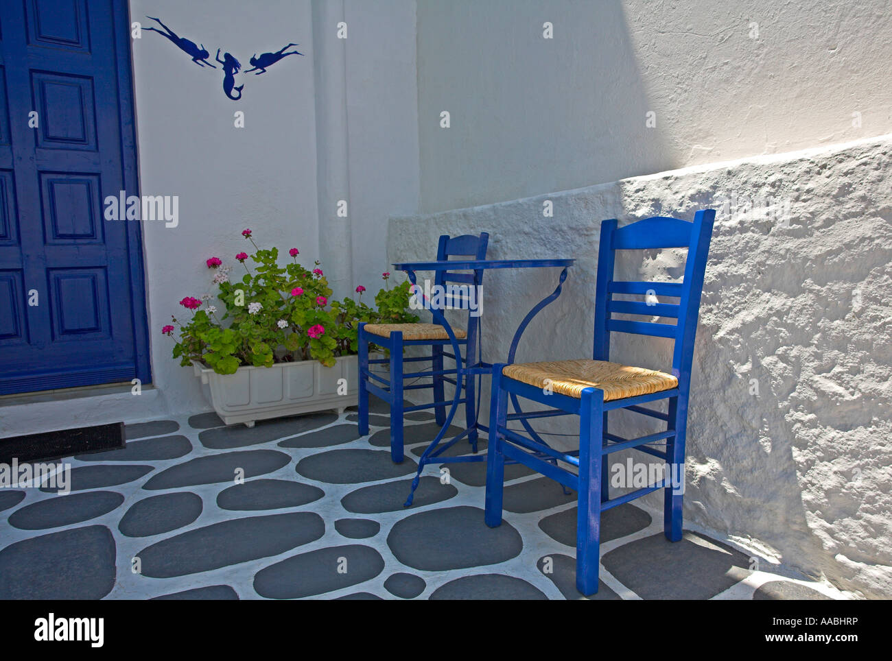Blue Chairs and Table, Mykonos, Greece Stock Photo - Alamy