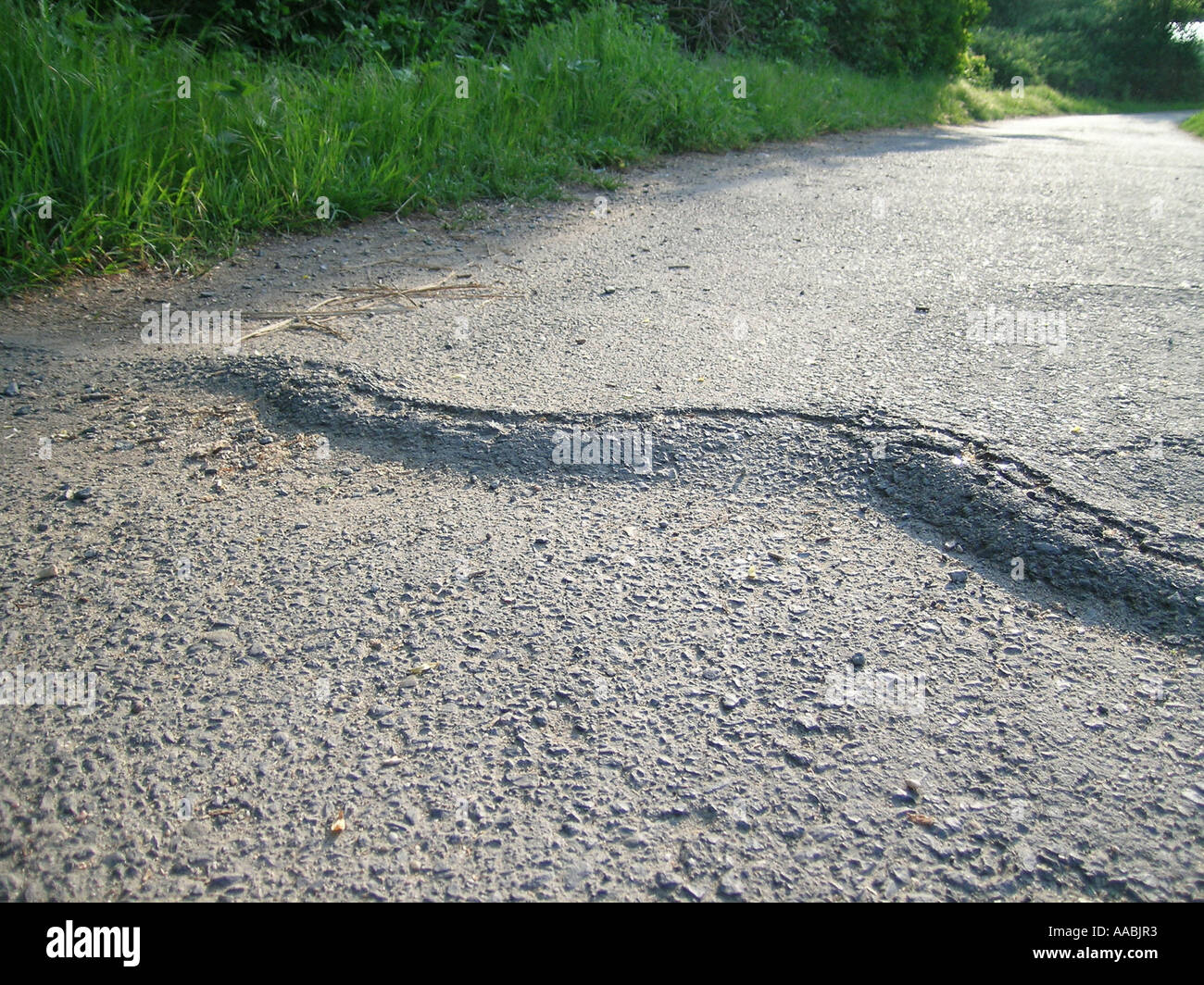 bumps in the asphalt Stock Photo - Alamy