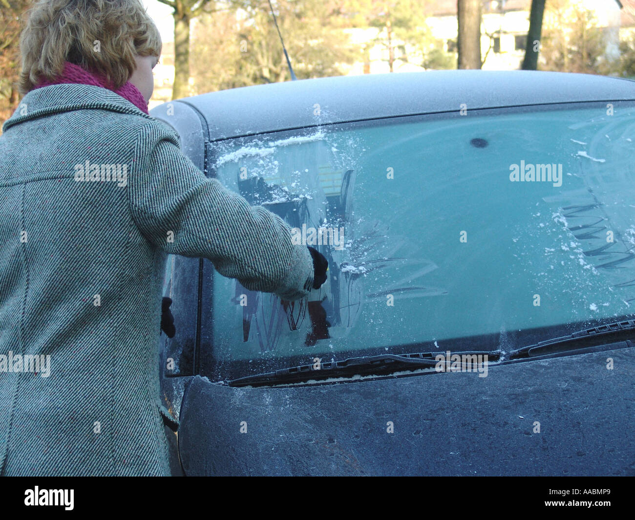 Woman scrape ice windscreen hi-res stock photography and images - Alamy