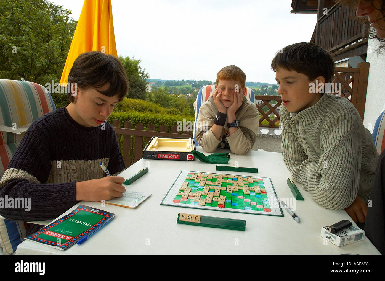 Family playing scrabble hi-res stock photography and images - Alamy