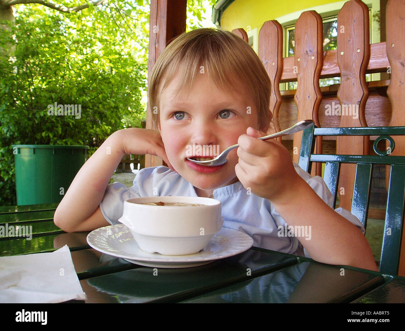 girl is eating soup Stock Photo - Alamy