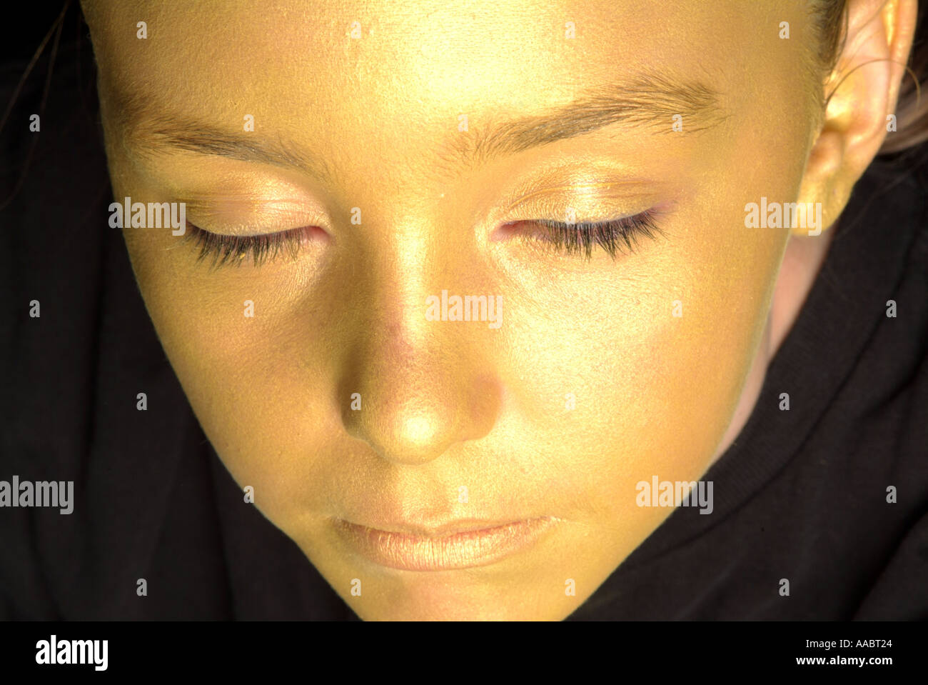 gold face girl Stock Photo - Alamy