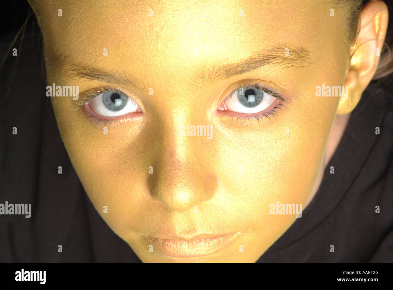 gold face girl Stock Photo - Alamy