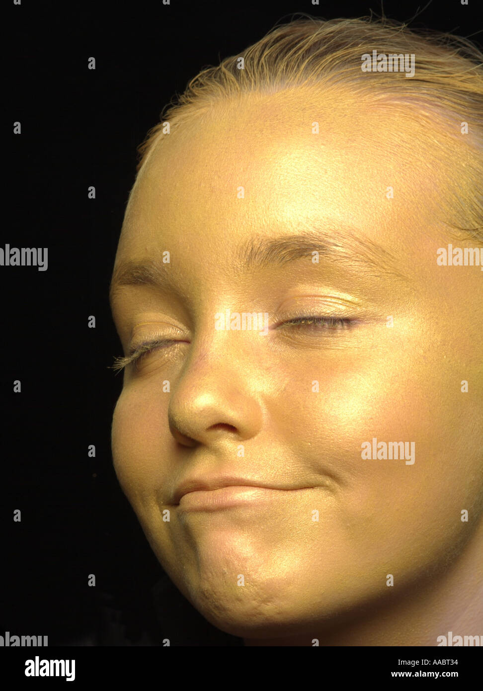 gold face girl Stock Photo - Alamy