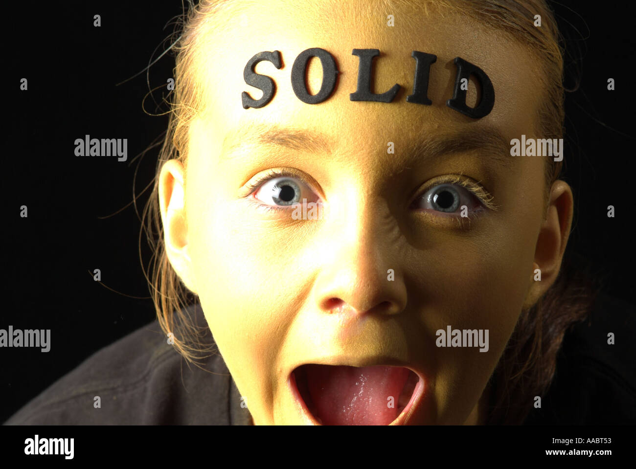 solid gold face girl Stock Photo - Alamy