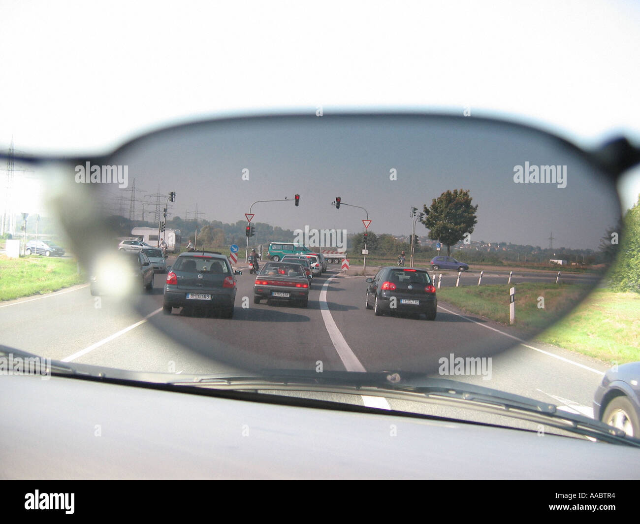 look / glance through sunglasses Stock Photo - Alamy