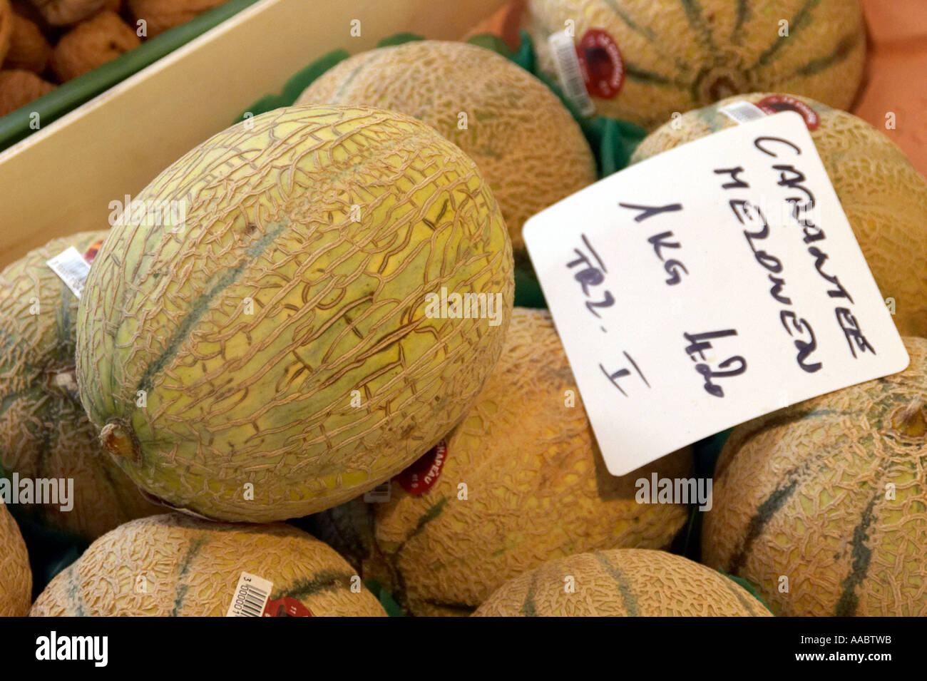 fruit stand with melons Stock Photo - Alamy