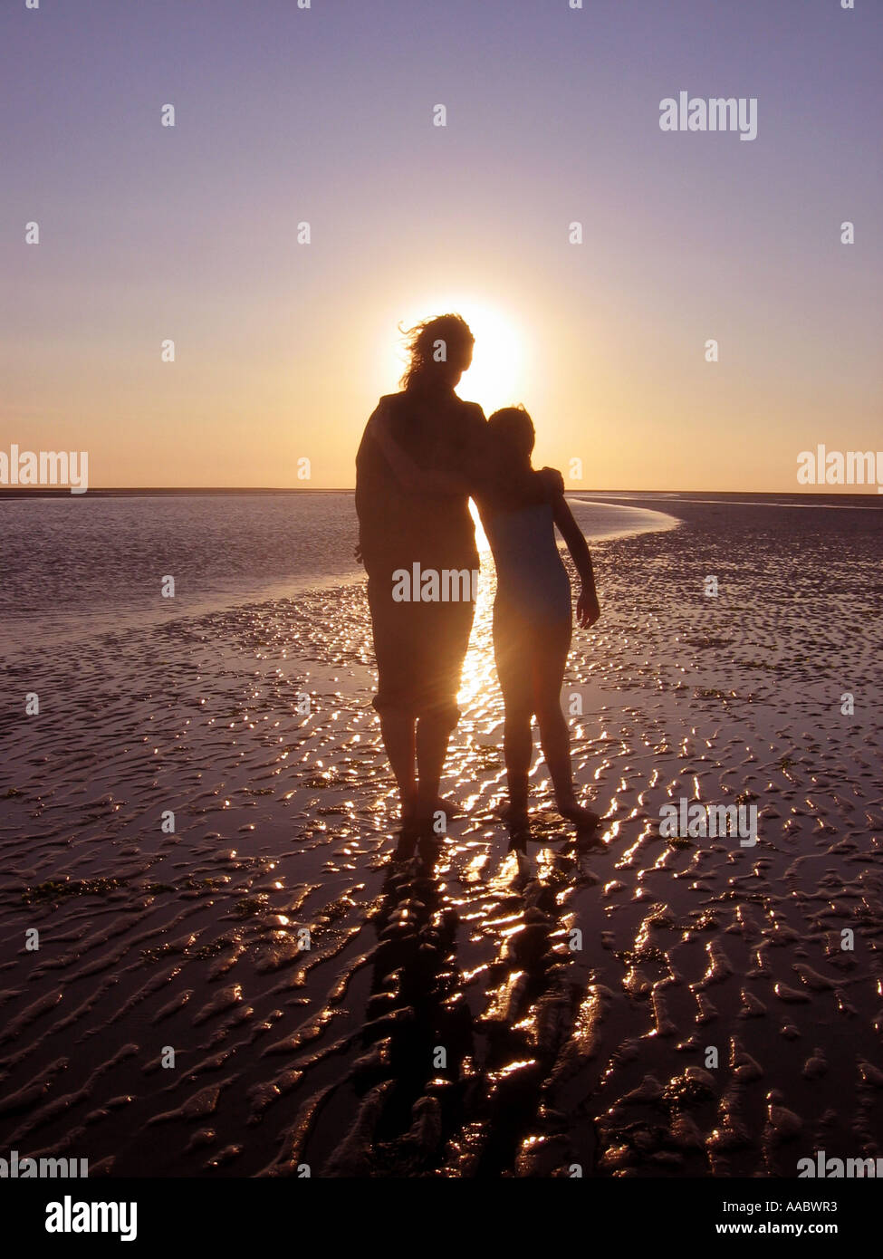Amorous couple on beach hi-res stock photography and images - Alamy