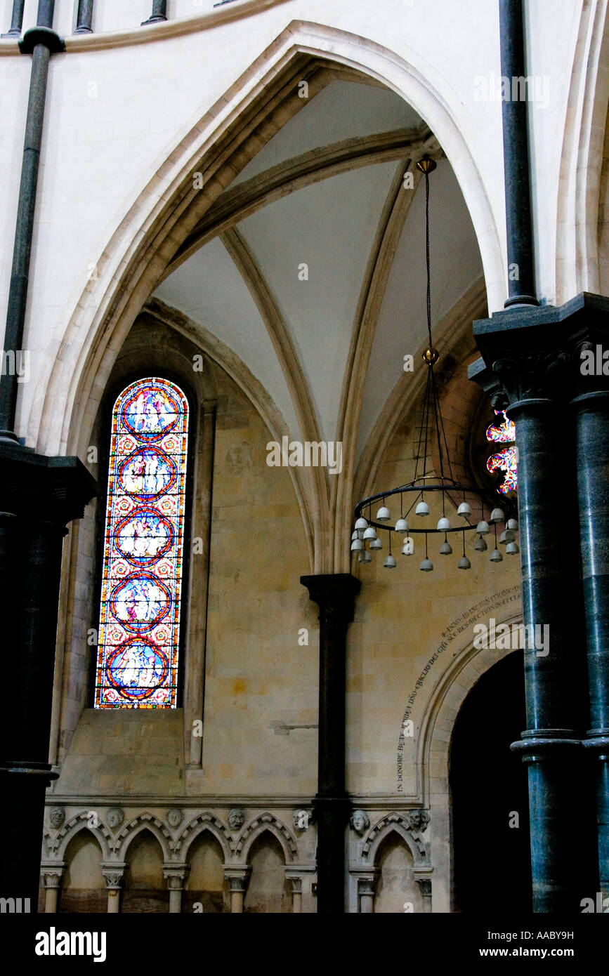 The interior columns and stained glass windows of the round part of ...